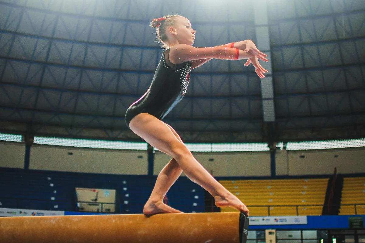 How Gymnasts Safely Progress from Low Beam to High Beam